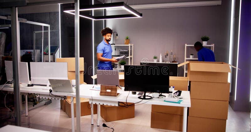 Professional Movers Packing Boxes Stock Photo - Image of packer ...