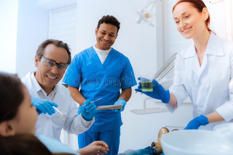 Professional Nice Doctors Looking a Their Young Patient Stock Image ...