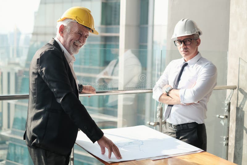 Professional Old Architect and Senior Foreman are Talking the Project ...