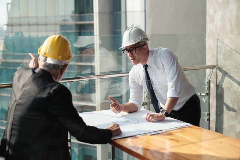 Professional Old Architect and Senior Foreman are Talking the Project ...