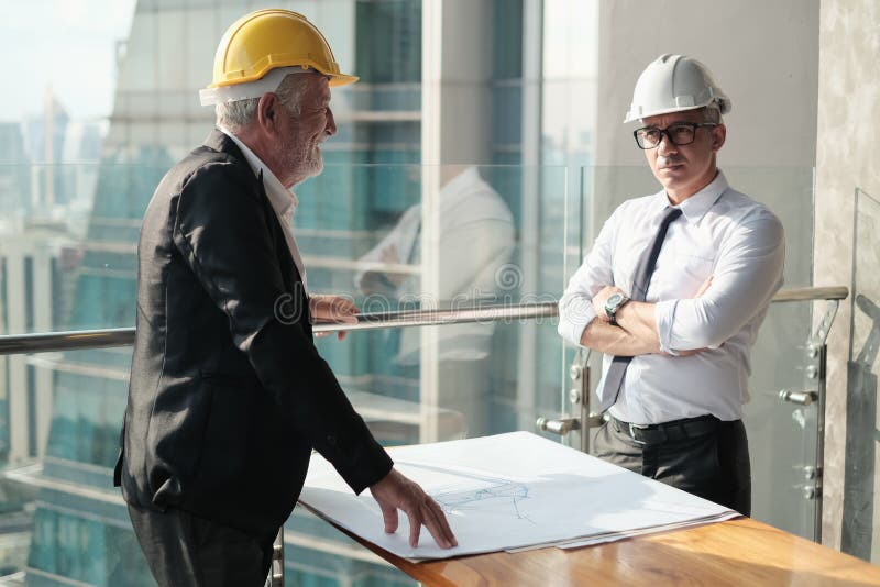 Professional Old Architect and Senior Foreman are Talking the Project ...