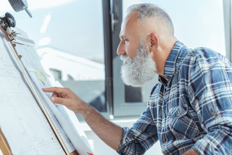 Professional Old Engineer is Working on Building Plan Stock Image ...
