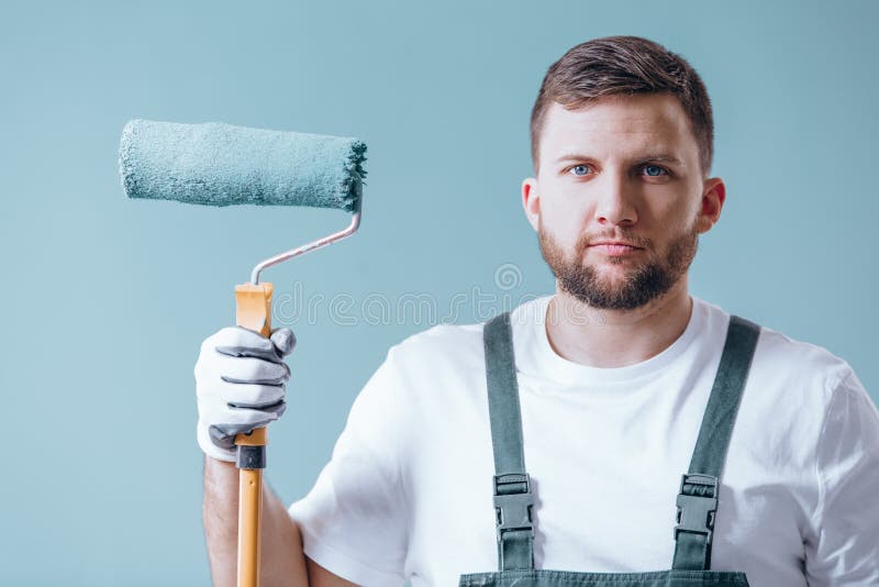 Professional Painter with Blue Roller Stock Photo - Image of occupation ...