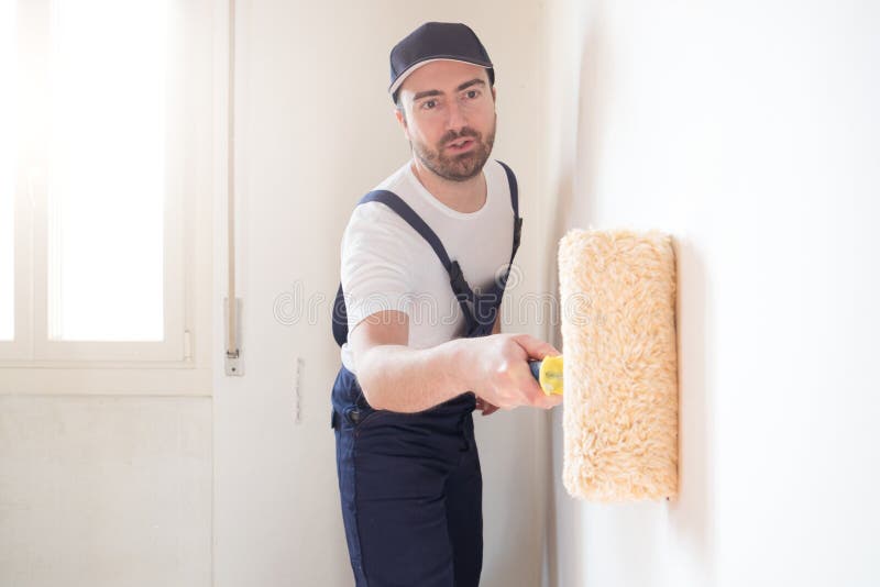 Professional Painter Worker is Painting One Wall Stock Photo - Image of ...
