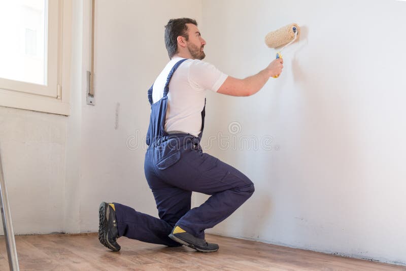 Professional Painter Worker is Painting One Wall Stock Image - Image of ...