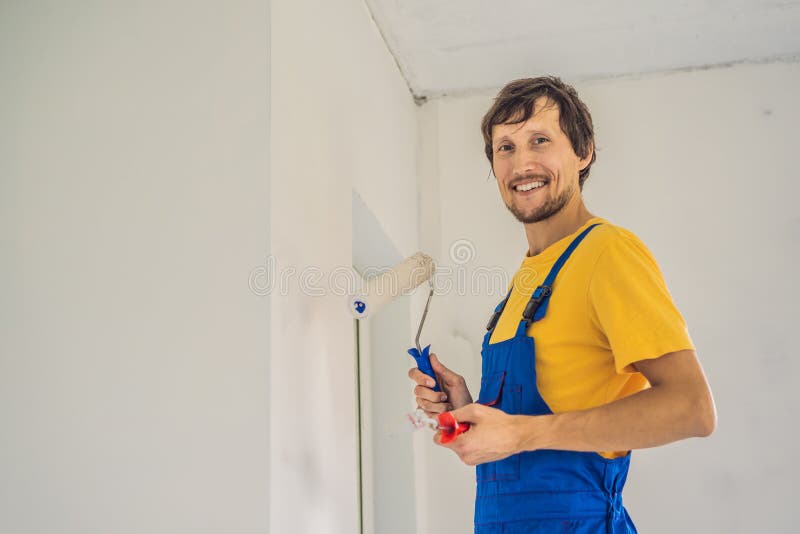 Professional Painter Worker Painting and Priming Wall with Painting ...