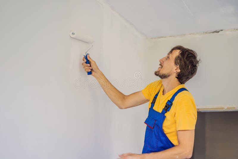 Professional Painter Worker Painting and Priming Wall with Painting ...
