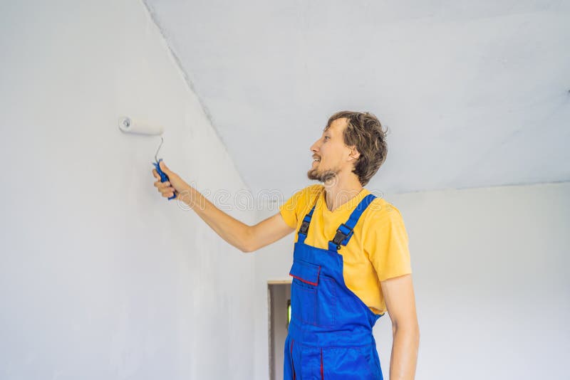 Professional Painter Worker Painting and Priming Wall with Painting ...