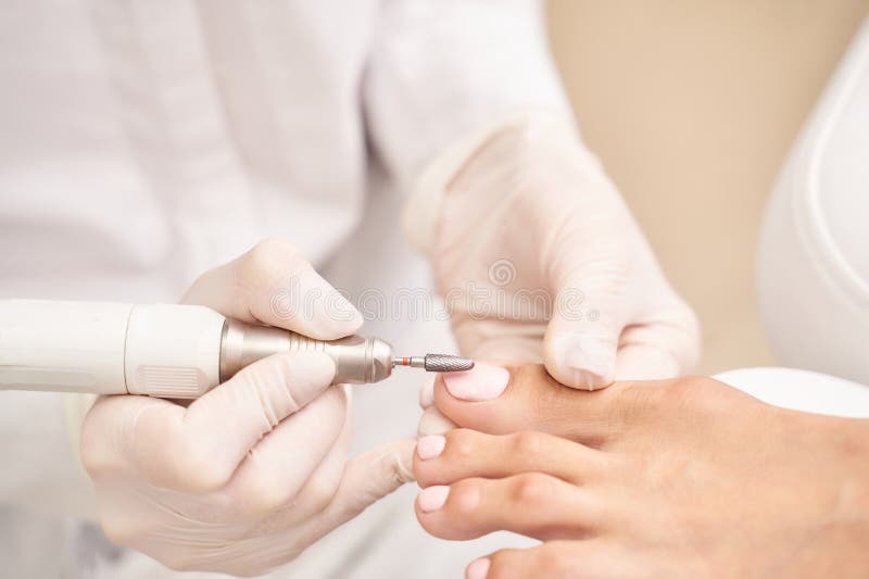 Professional Pedicure Treatment on Female Feet with Machine Tool by ...