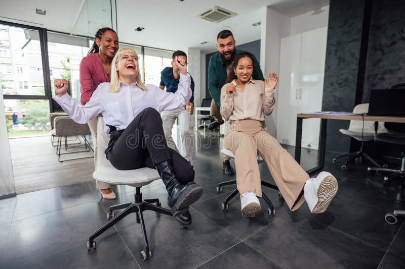 Professional People Racing with the Chairs while on a Break in the ...