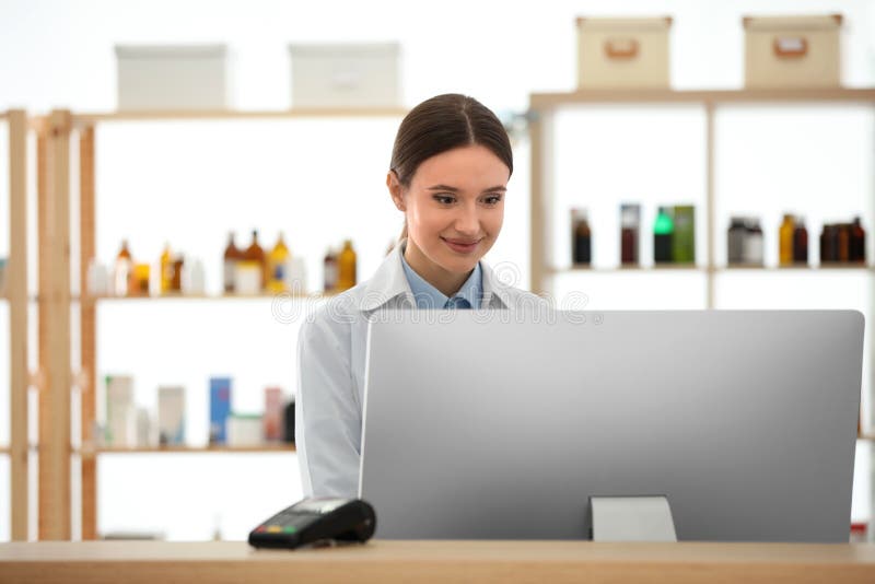 Professional Pharmacist Working with Computer in Drugstore Stock Image ...