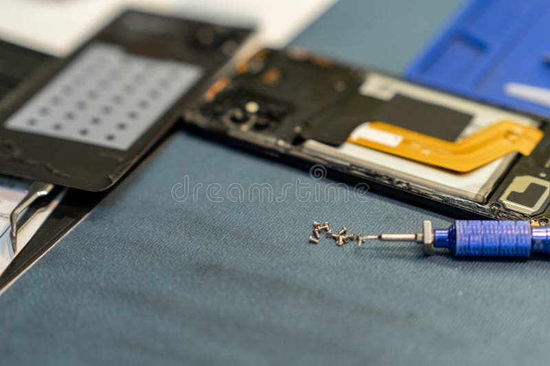 Professional Phone Repair with Tools and Components Laid Out on a ...