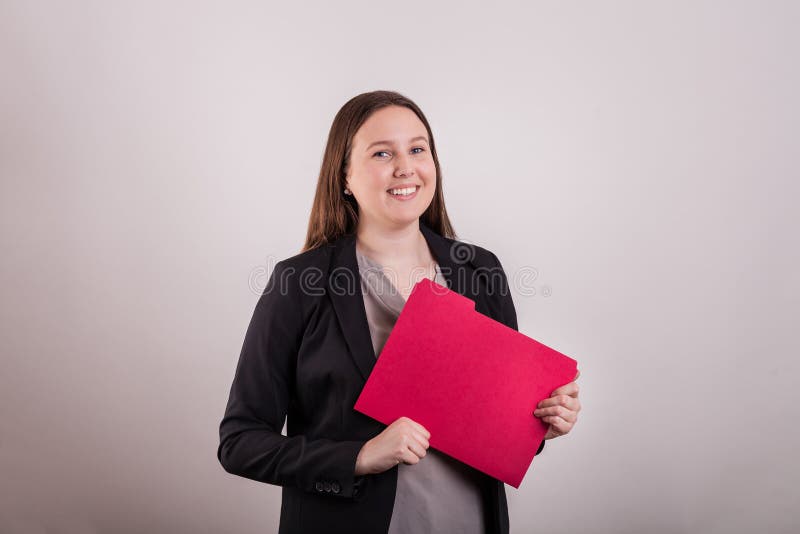 Young Business Professional Women in Suit Holding File Folder Stock ...