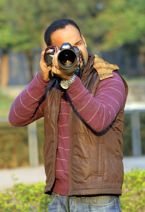 Professional Photographer Working with Photos in Office Stock Photo ...