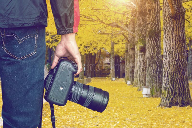 Professional Photographer with Camera in Autumn. Stock Photo - Image of ...