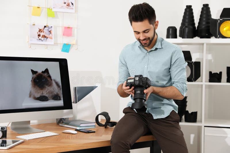 Professional Photographer with Camera Working in Modern Office Stock ...