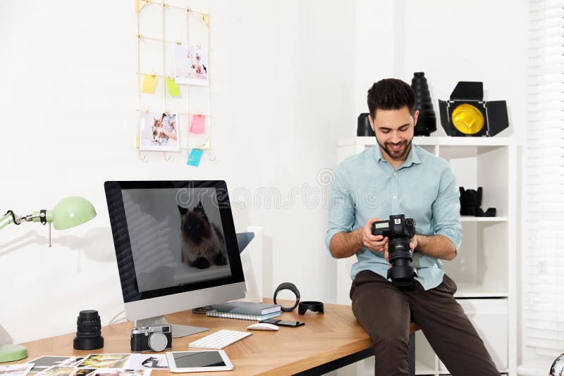 Professional Photographer with Camera Working in Modern Office Stock ...