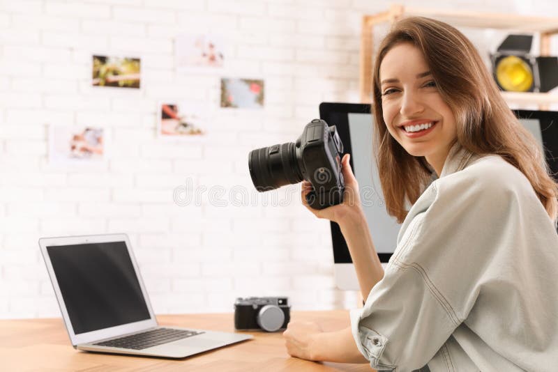 Professional Photographer with Camera Working at Table Stock Image ...