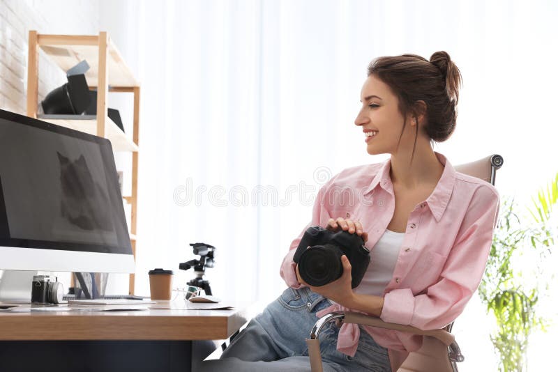 Professional Photographer with Camera Working at Table Stock Photo ...