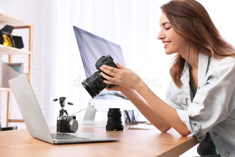 Professional Photographer with Camera Working at Table Stock Photo ...