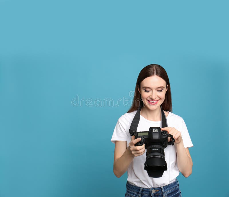 Professional Photographer with Camera on Light Blue Background. Space ...