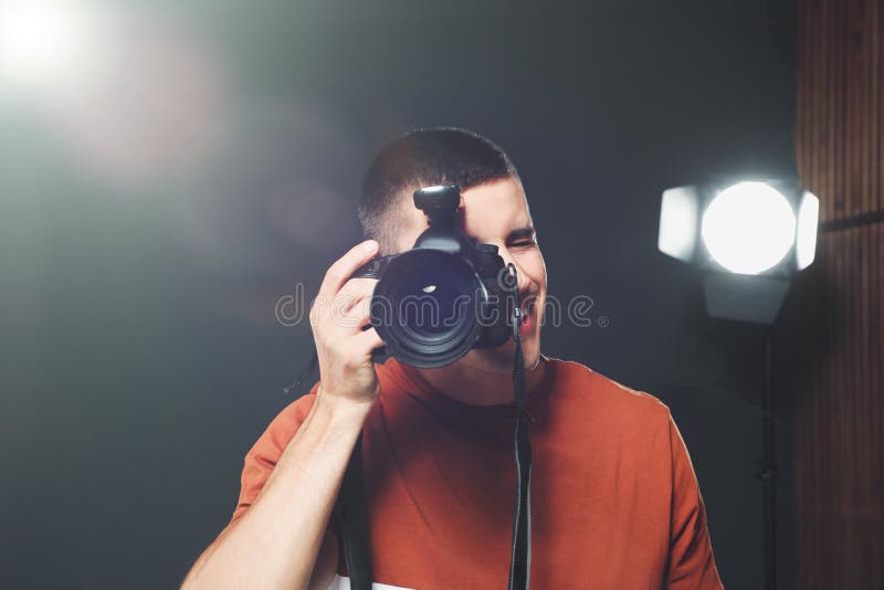Professional Photographer Taking Picture in Modern Studio Stock Photo ...