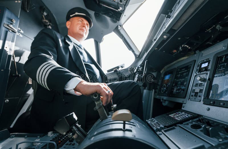 A Professional Pilot is in the Cockpit. Conception of Work Stock Image ...