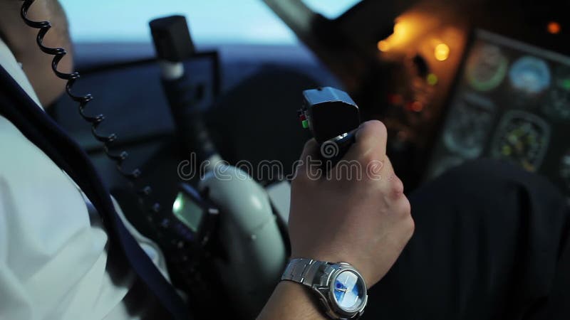 Professional Pilot Coordinating Flight Details, Talking on Radio To ...