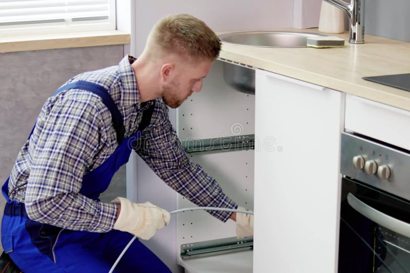 Professional Plumber Using Plunger To Unclog Drain: Cleaning Stock ... Professional Plumber Using Plunger To Unclog Drain: Cleaning Stock ...