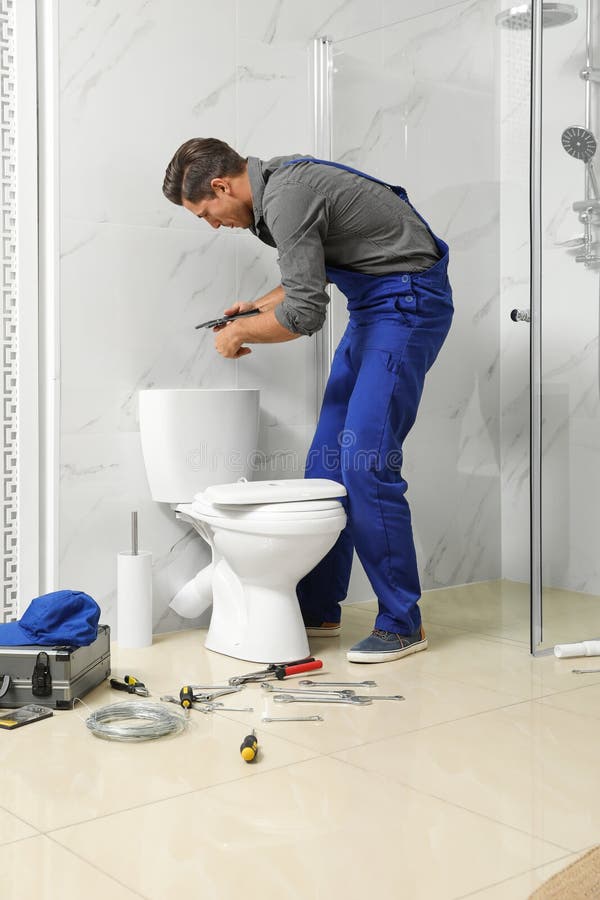 Professional Plumber Working with Toilet Bowl Stock Image - Image of ...