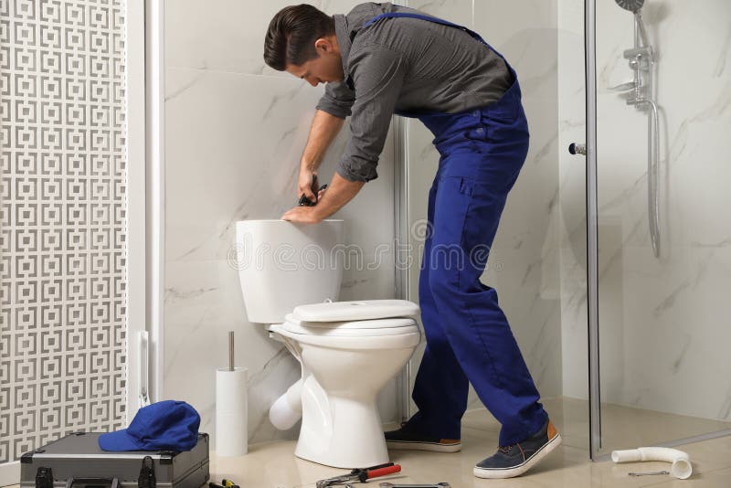 Professional Plumber Working with Toilet Bowl Stock Photo - Image of ...