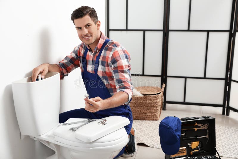 Professional Plumber Working with Toilet Bowl Stock Image - Image of ...