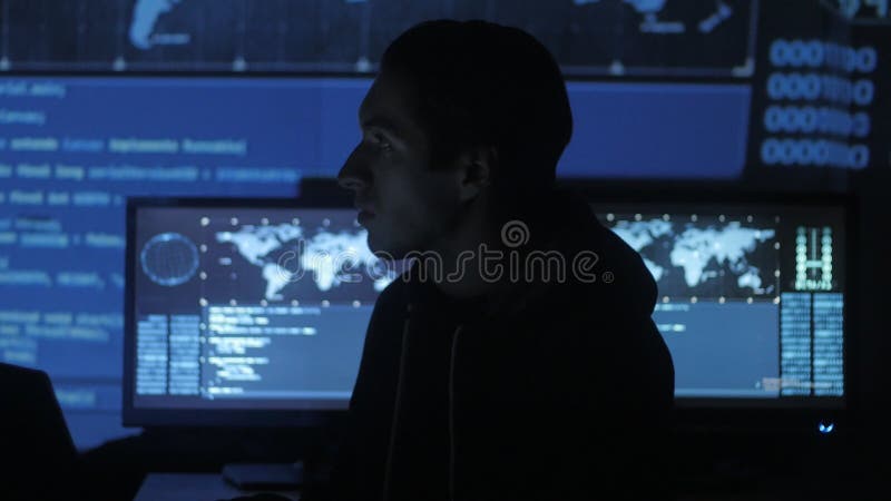 Young Geek Hacker Programmer is Working on Computer in Cyber Security ...