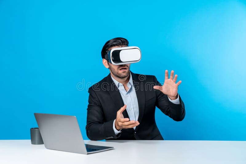 Project Manager Looking by Using VR Goggle while Sitting at Laptop ...