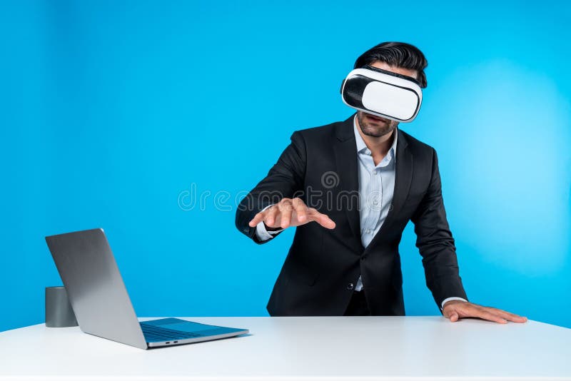 Project Manager Looking by Using VR Goggle while Sitting at Laptop ...