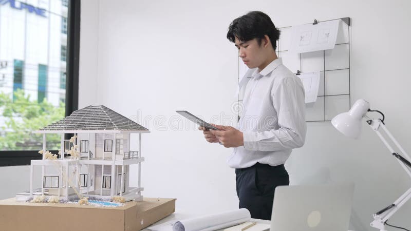 Professional Project Manager Using Tablet To Check House Model ... Professional Project Manager Using Tablet To Check House Model ...