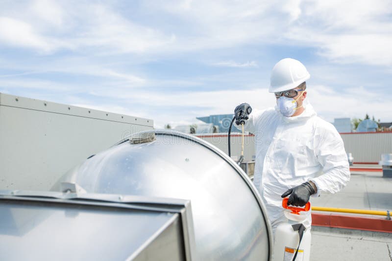 Professional in Protective Uniform, Mask, Gloves in the Roof for ...