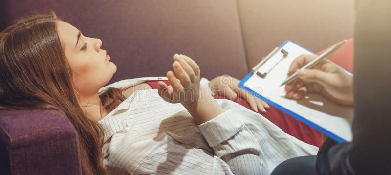 Professional Psychologist Writes Notes While Young Female Patient