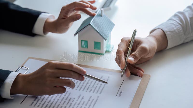 Professional Real Estate Agent Guiding and Explaining the Document ...