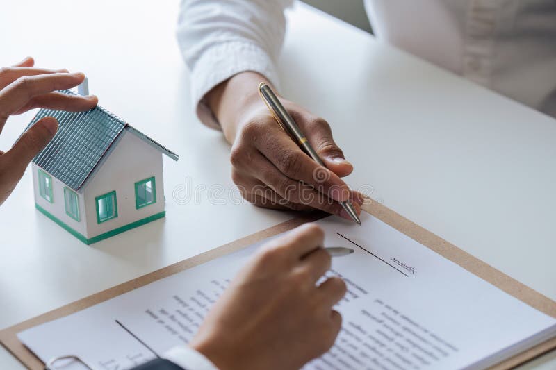 Professional Real Estate Agent Guiding and Explaining the Document ...