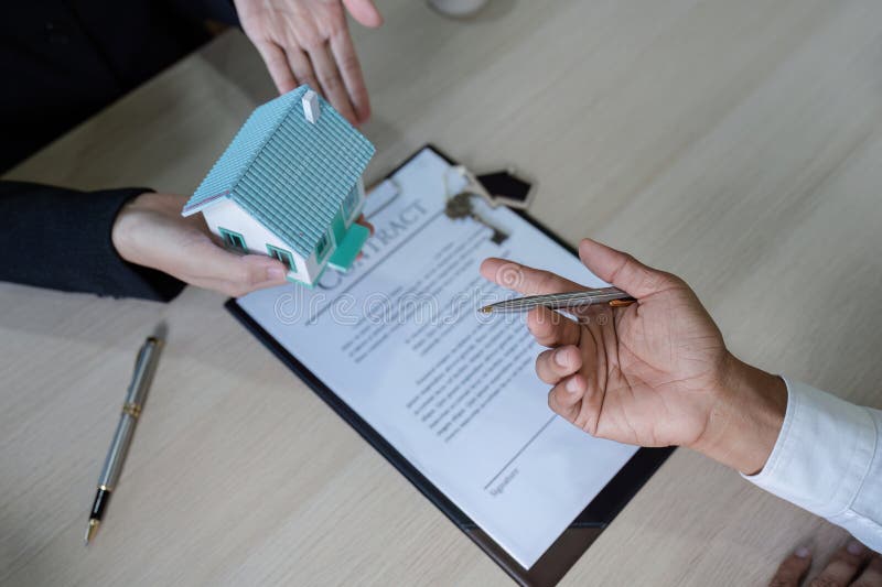 Professional Real Estate Agent Guiding and Explaining the Document ...