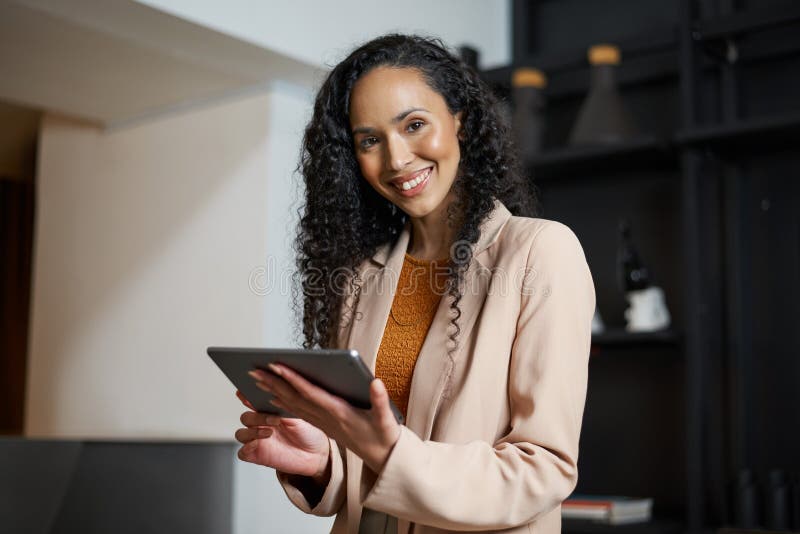Professional Receptionist Using a Tablet Device in a Modern Hotel Lobby ...