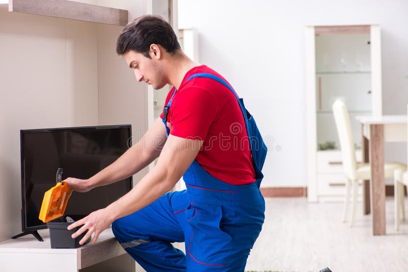 The Professional Repair Engineer Repairing Broken Tv Stock Photo ...