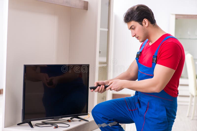 The Professional Repair Engineer Repairing Broken Tv Stock Photo ...