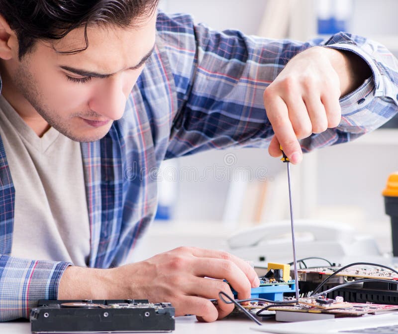 Professional Repairman Repairing Computer in Workshop Stock Image ...