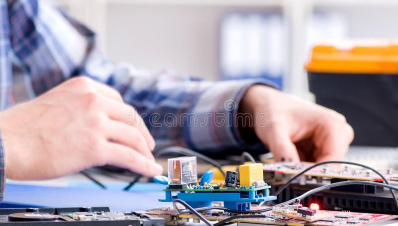 Professional Repairman Repairing Computer in Workshop Stock Photo ...