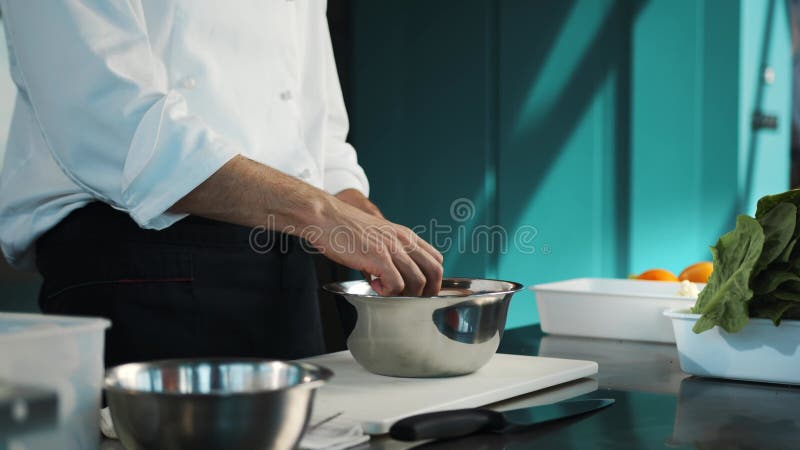 Professional Restaurant Kitchen: Chef Breaks Eggs in a Bowl Stock ...