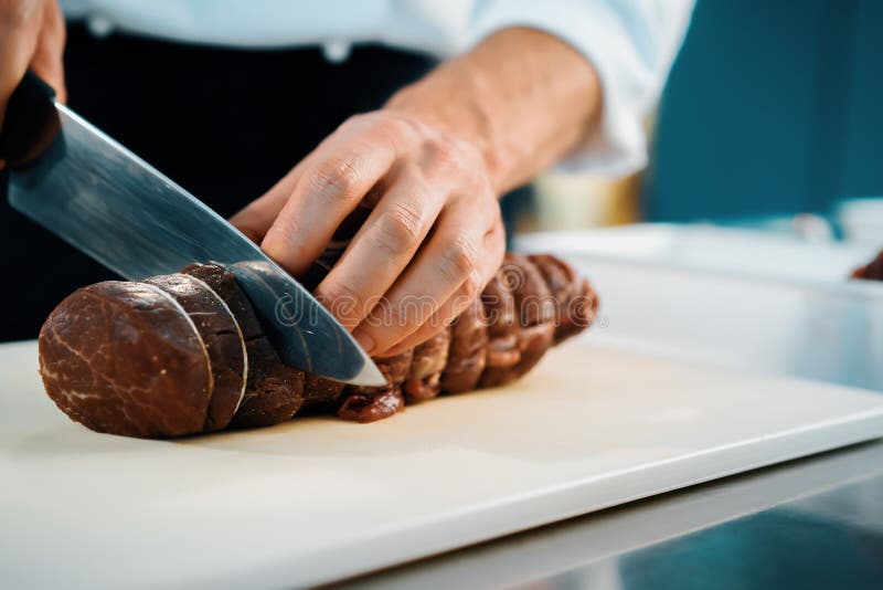 Professional Restaurant Kitchen, Close-up: Chef Cut Meat for Filet ...