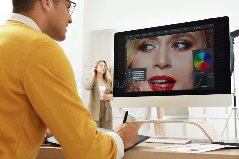 Professional Retoucher Working with Graphic Tablet at Desk in Photo ...