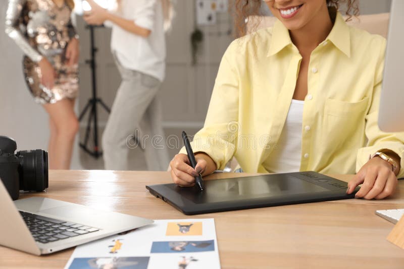 Professional Retoucher Working with Graphic Tablet at Desk in Photo ...